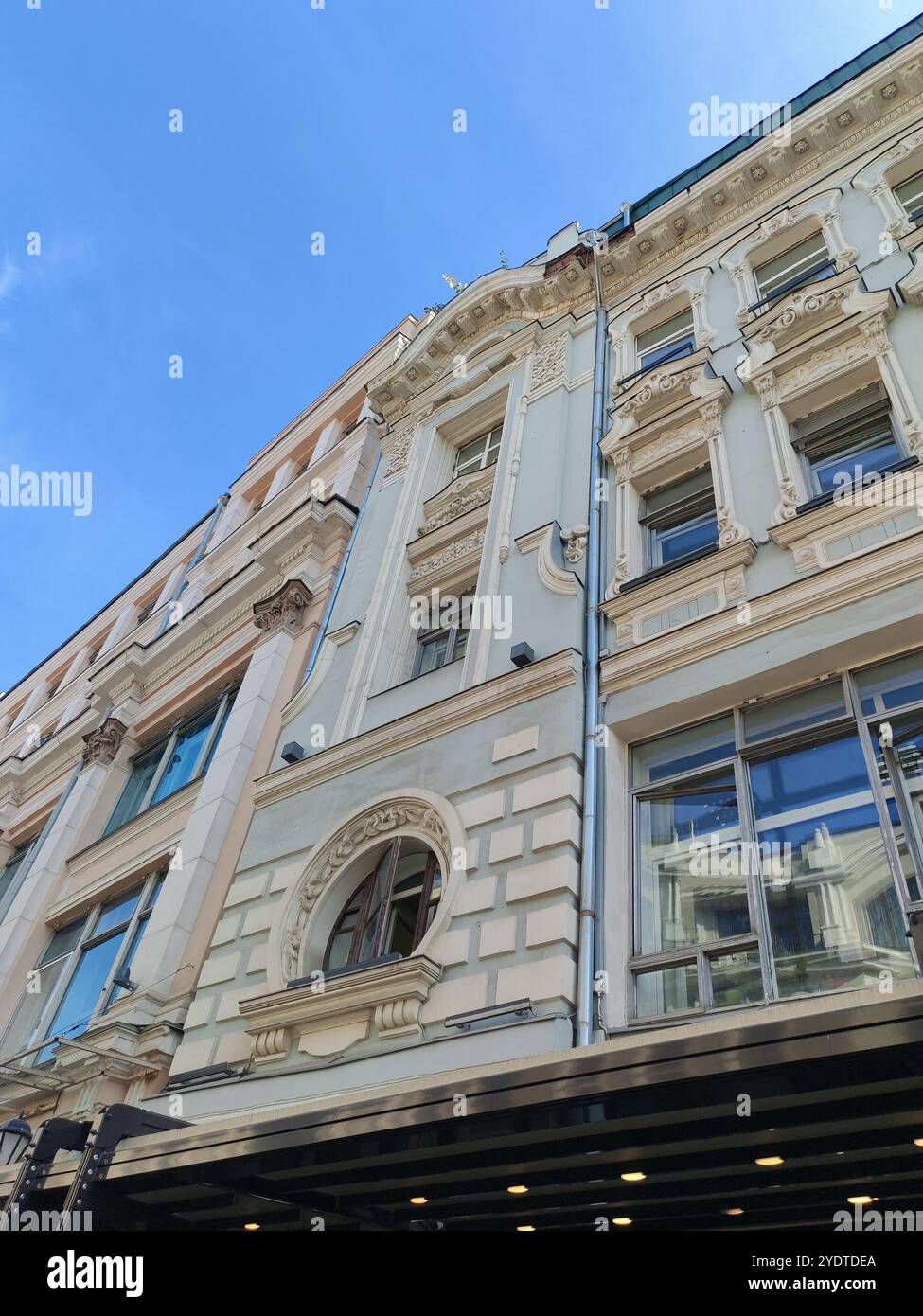 large multi-story building with a classic facade featuring arched ...