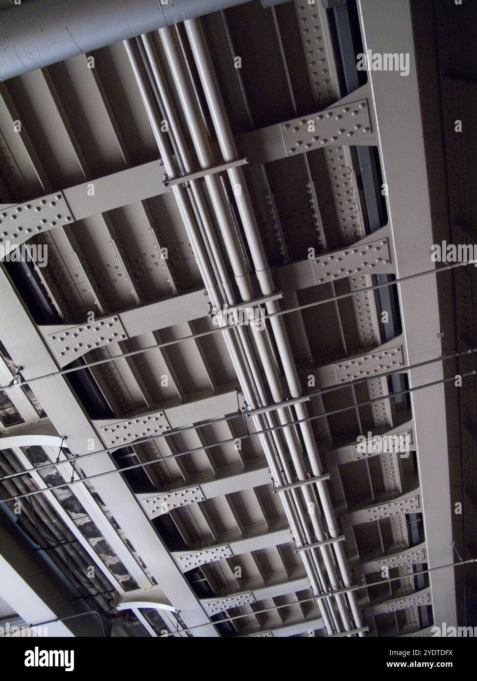Steel frames under railway girders Stock Photo - Alamy