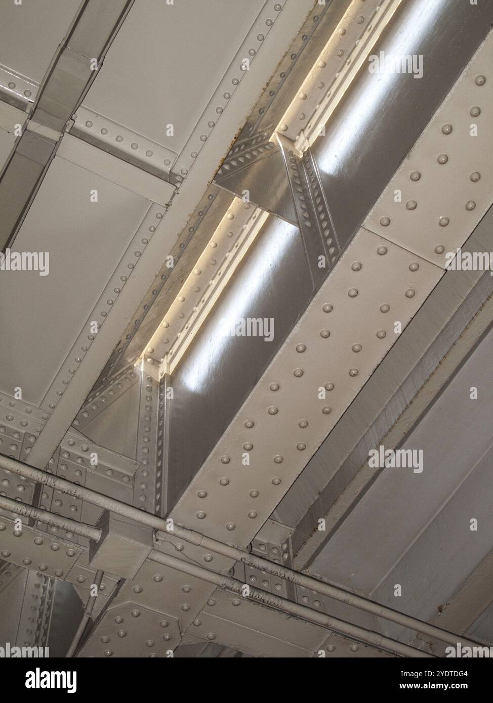 Steel frames under railway girders Stock Photo - Alamy