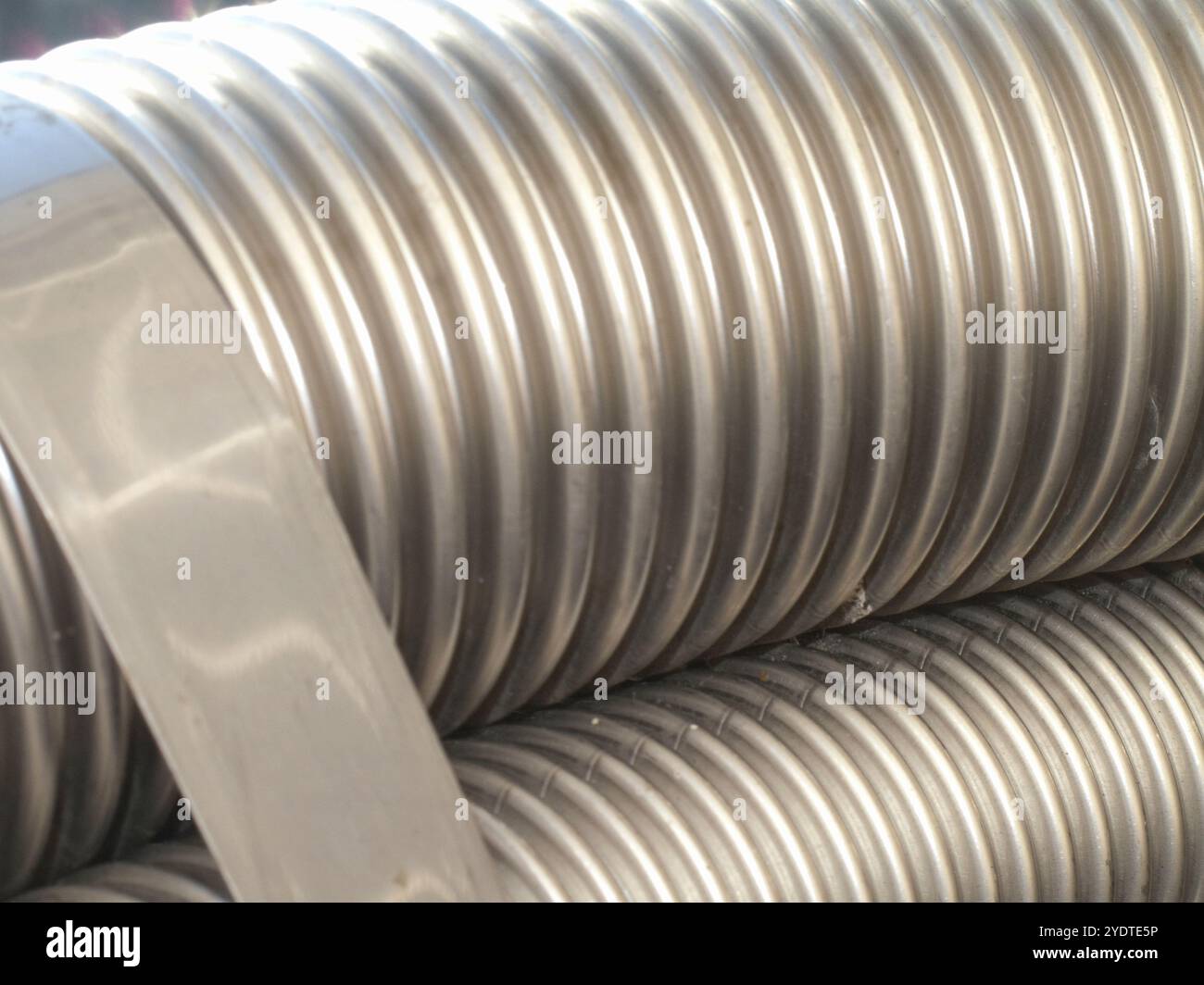 Flexible tube in aluminium Stock Photo - Alamy