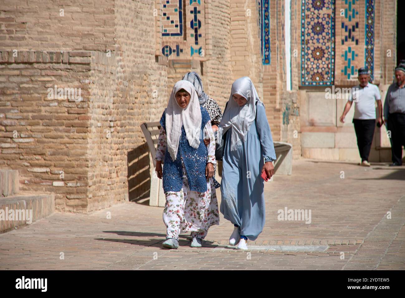 Samarkand, Uzbekistan; September 18, 2024:a mother and daughter walking ...