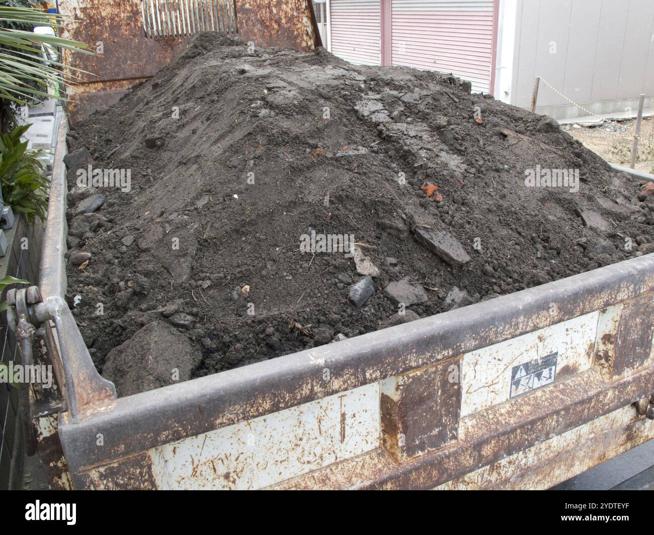 Dump truck loaded with earth and sand Stock Photo - Alamy