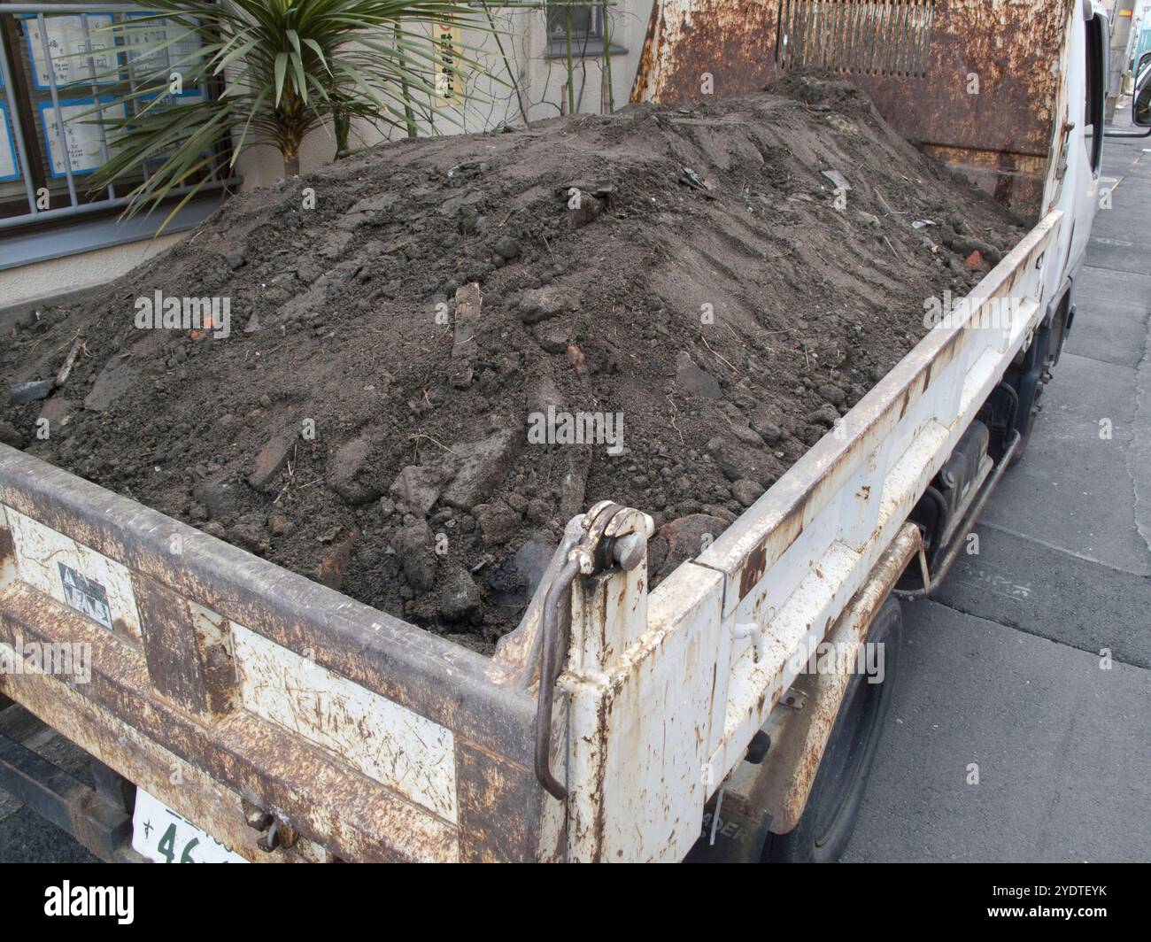 Dump truck loaded with earth and sand Stock Photo - Alamy