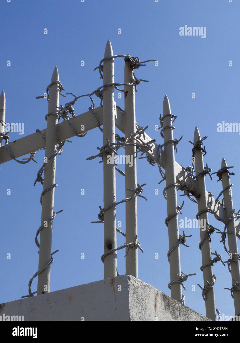 Barbed wire security fence Stock Photo - Alamy