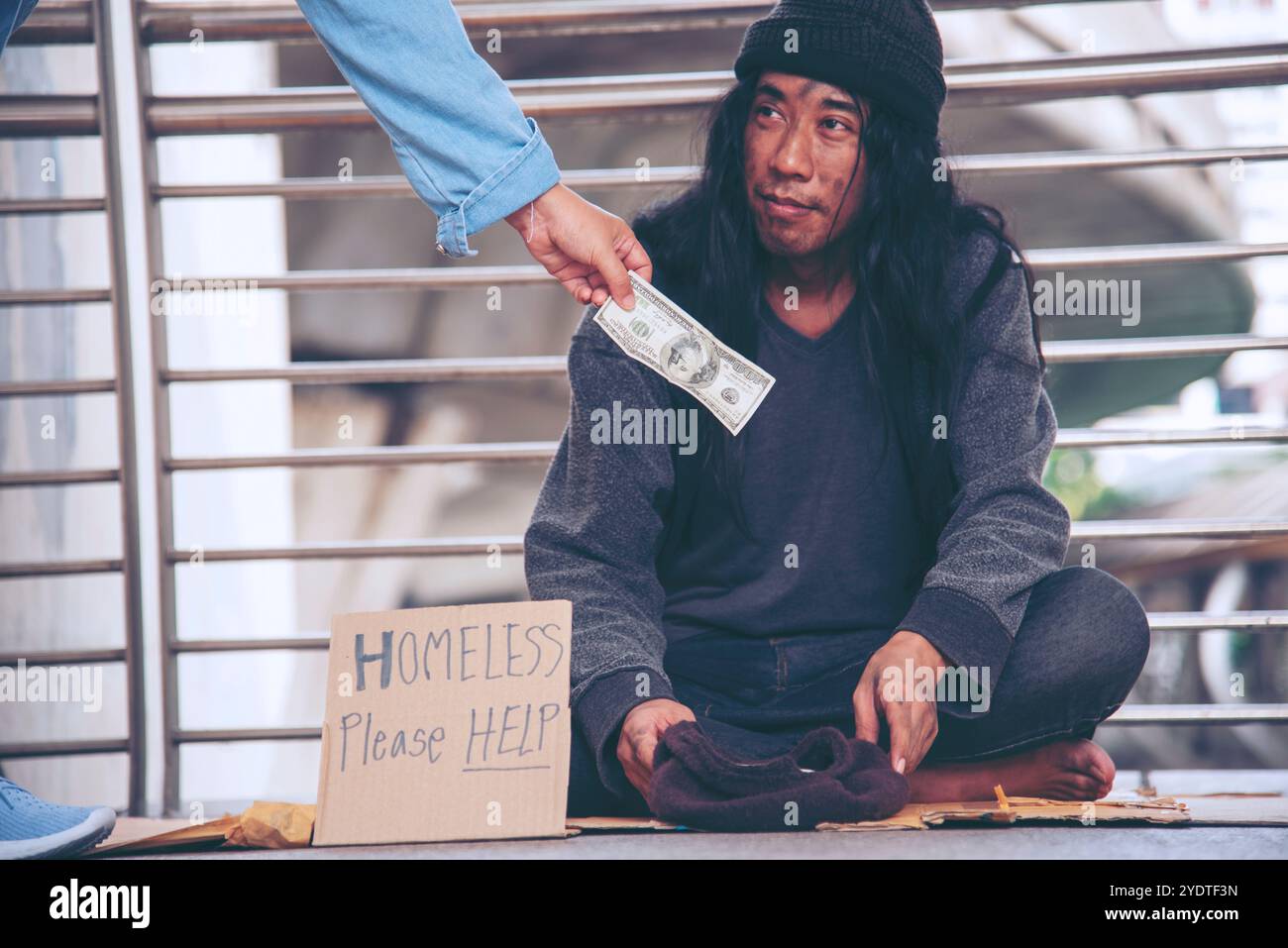 Woman helping hands to homeless people poverty beggar man holding hands ...