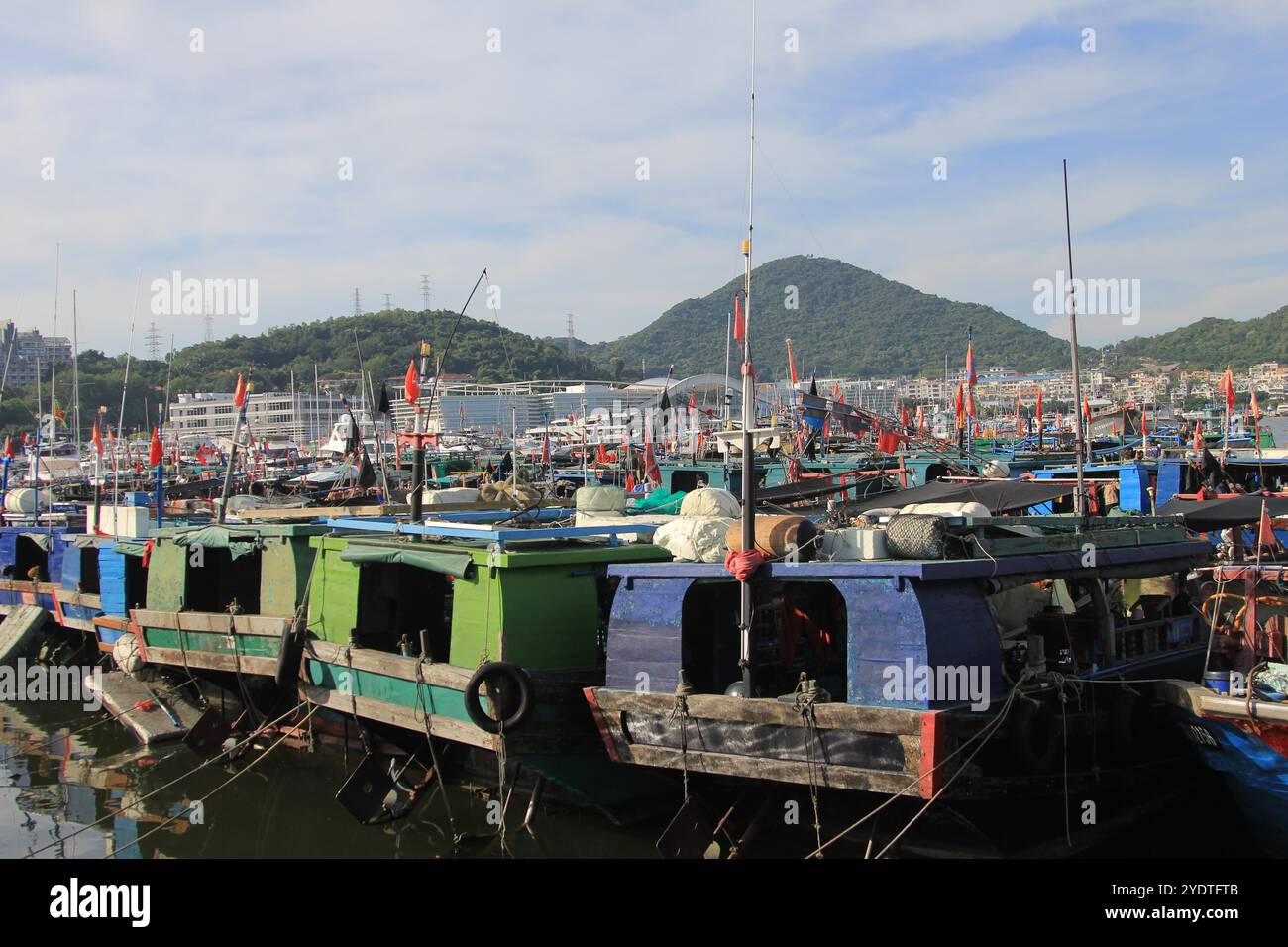 Fishing vessels anchor at a harbor to avoid approaching Typhoon Trami ...