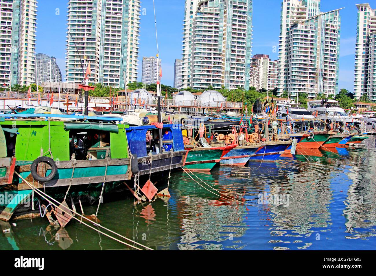 Fishing vessels anchor at a harbor to avoid approaching Typhoon Trami ...