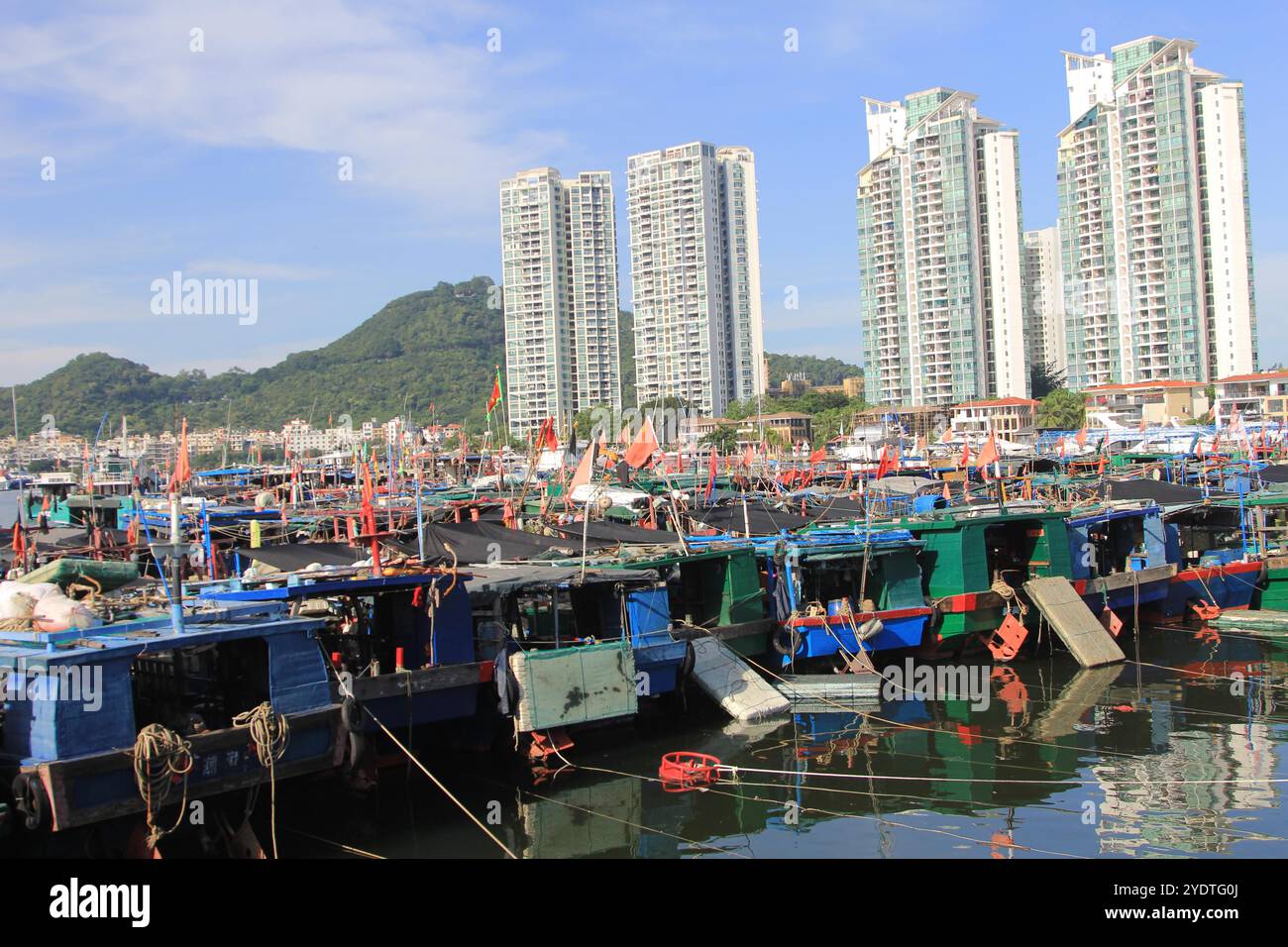 Fishing vessels anchor at a harbor to avoid approaching Typhoon Trami ...