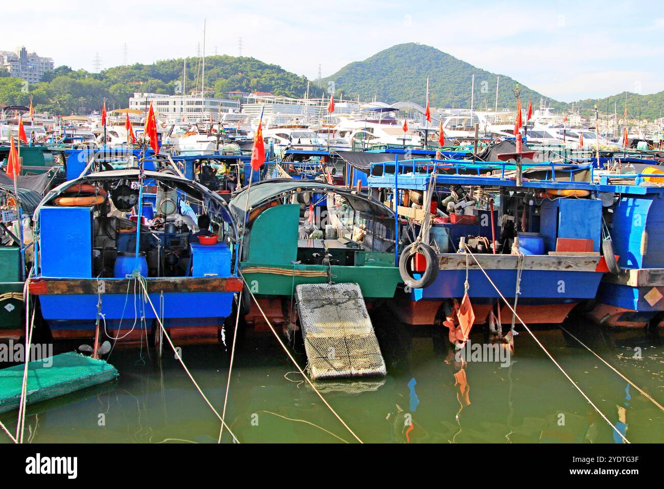 Fishing vessels anchor at a harbor to avoid approaching Typhoon Trami ...
