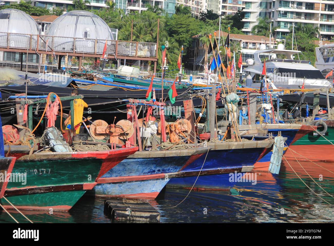 Fishing vessels anchor at a harbor to avoid approaching Typhoon Trami ...