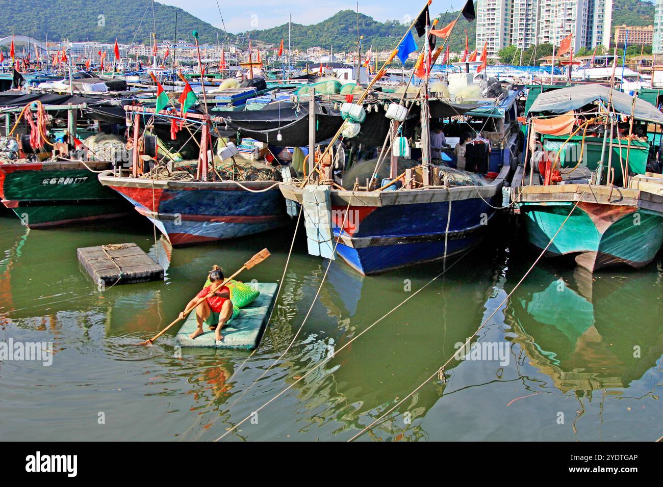 Fishing vessels anchor at a harbor to avoid approaching Typhoon Trami ...