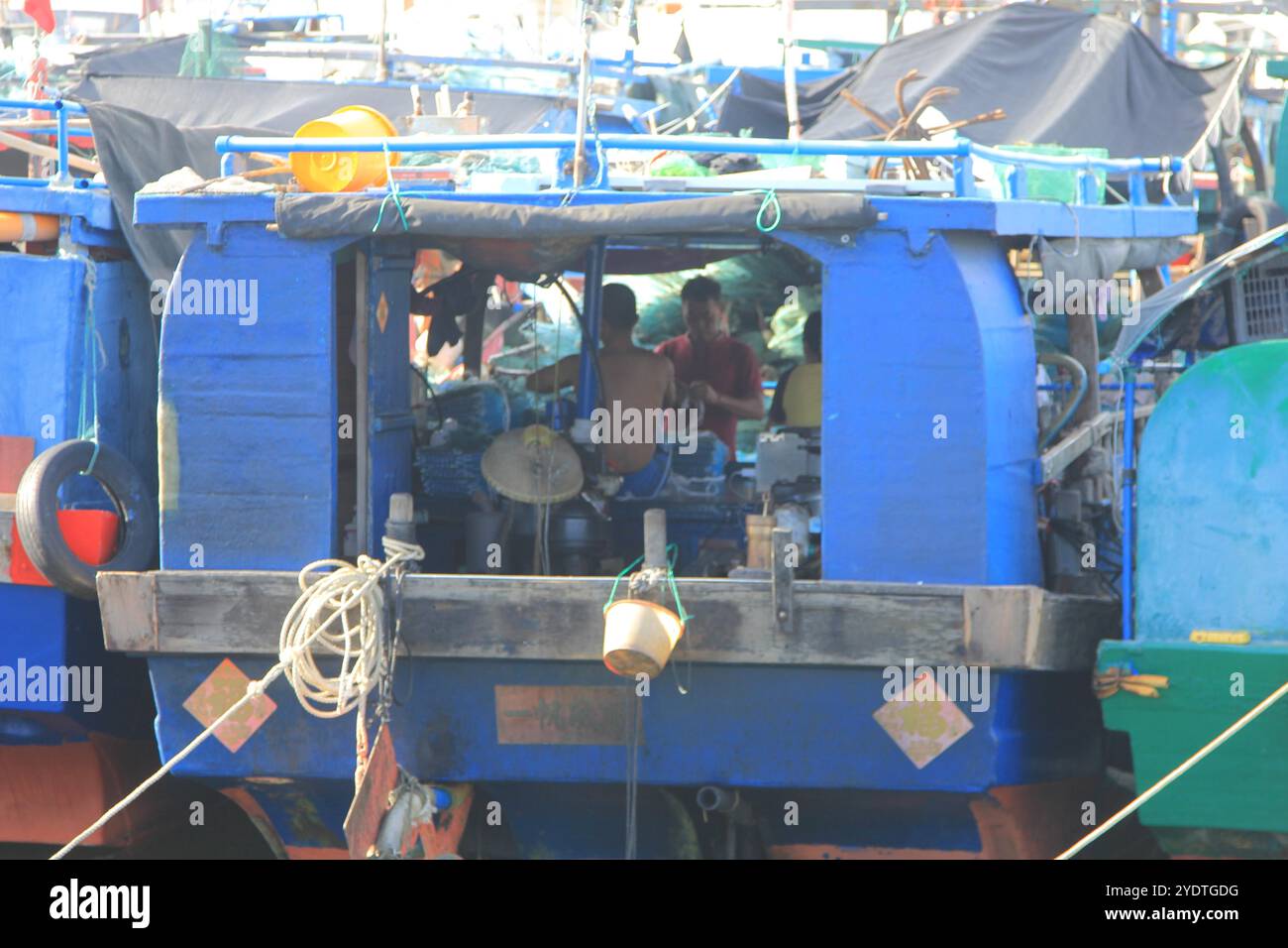 Fishing vessels anchor at a harbor to avoid approaching Typhoon Trami ...
