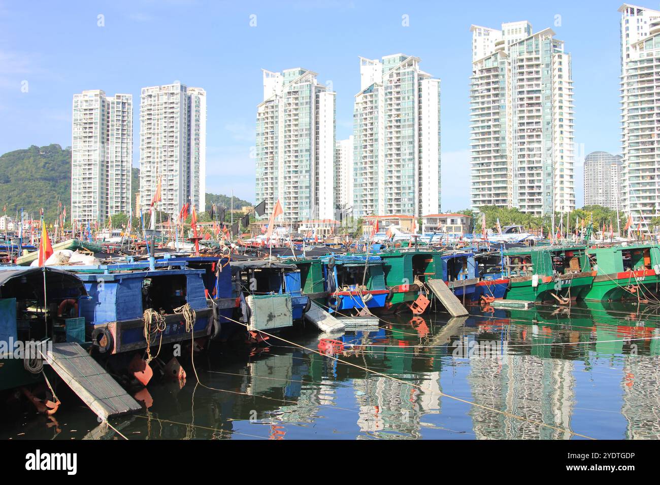 Fishing vessels anchor at a harbor to avoid approaching Typhoon Trami ...