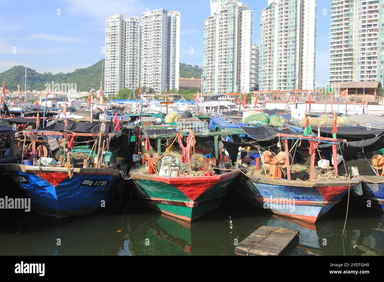Fishing vessels anchor at a harbor to avoid approaching Typhoon Trami ...