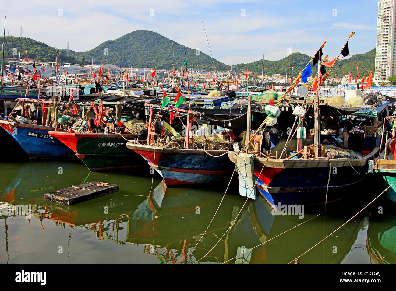 Fishing vessels anchor at a harbor to avoid approaching Typhoon Trami ...