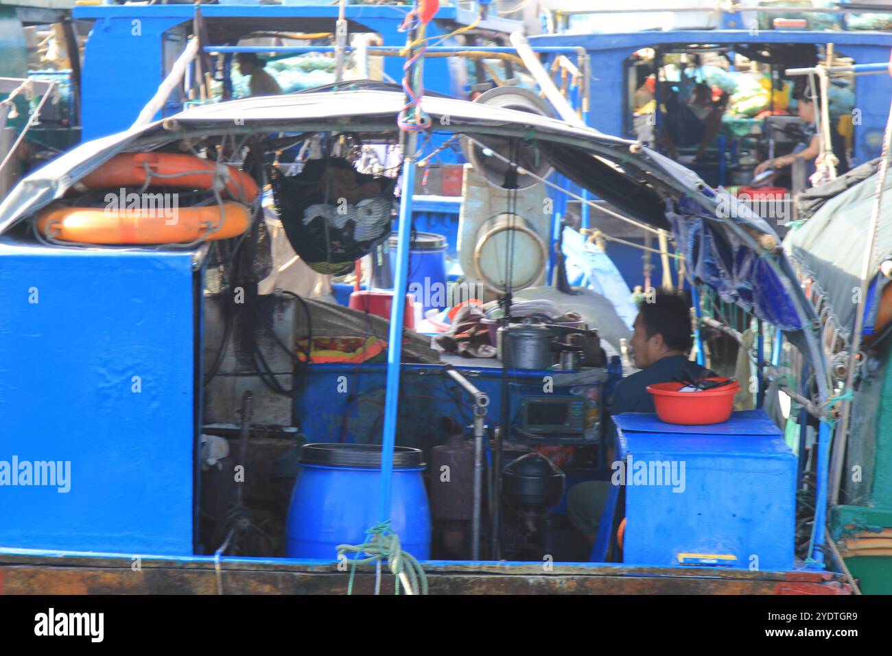 Fishing vessels anchor at a harbor to avoid approaching Typhoon Trami ...