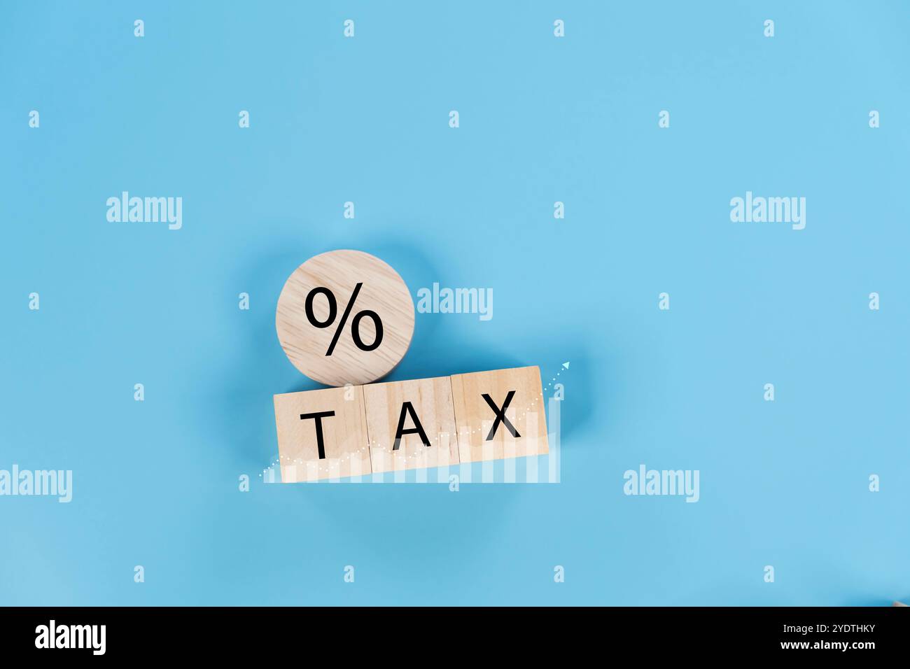 Tax wording on wooden cube block array on coins stacking with technical ...