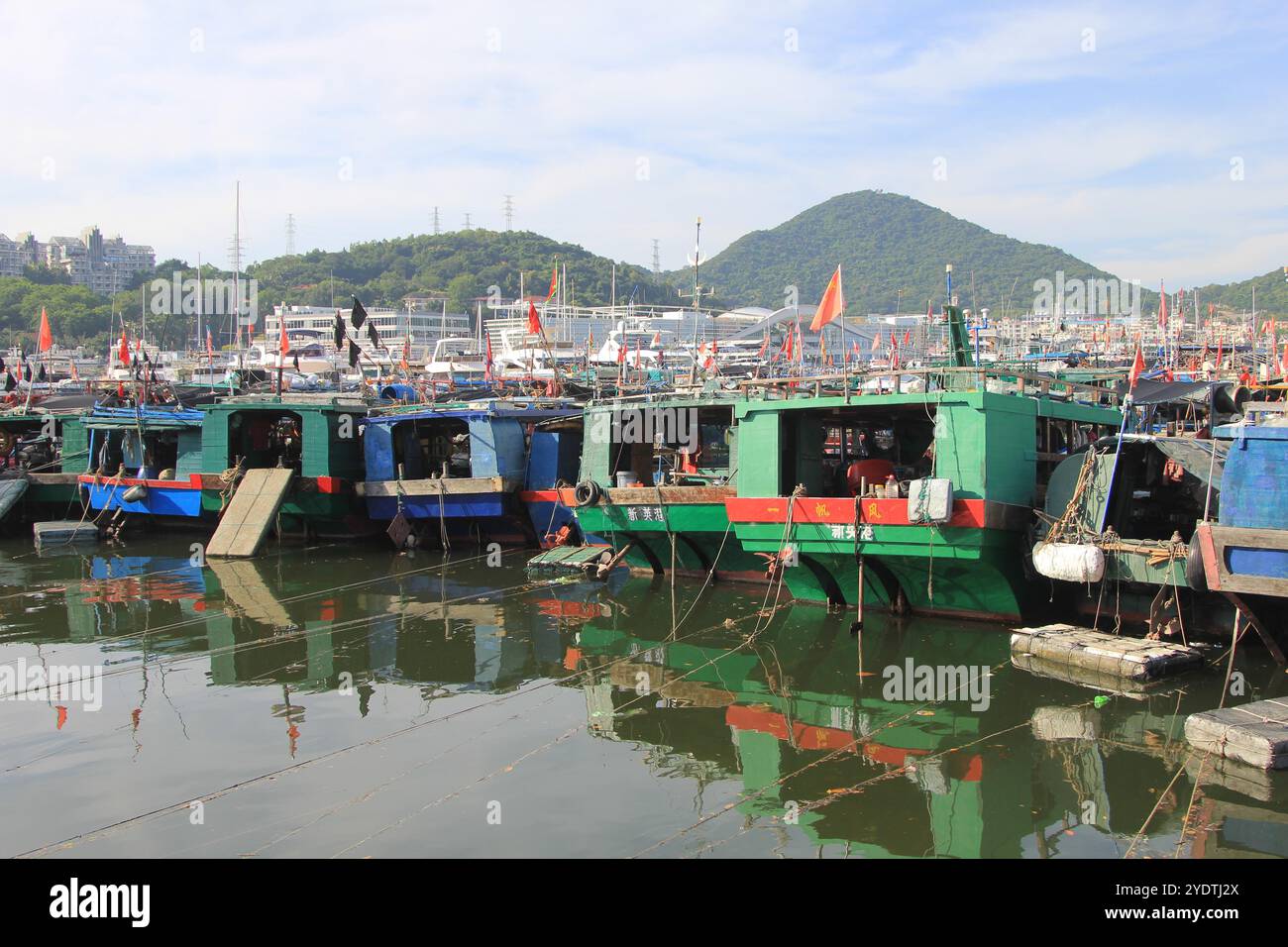 Fishing vessels anchor at a harbor to avoid approaching Typhoon Trami ...