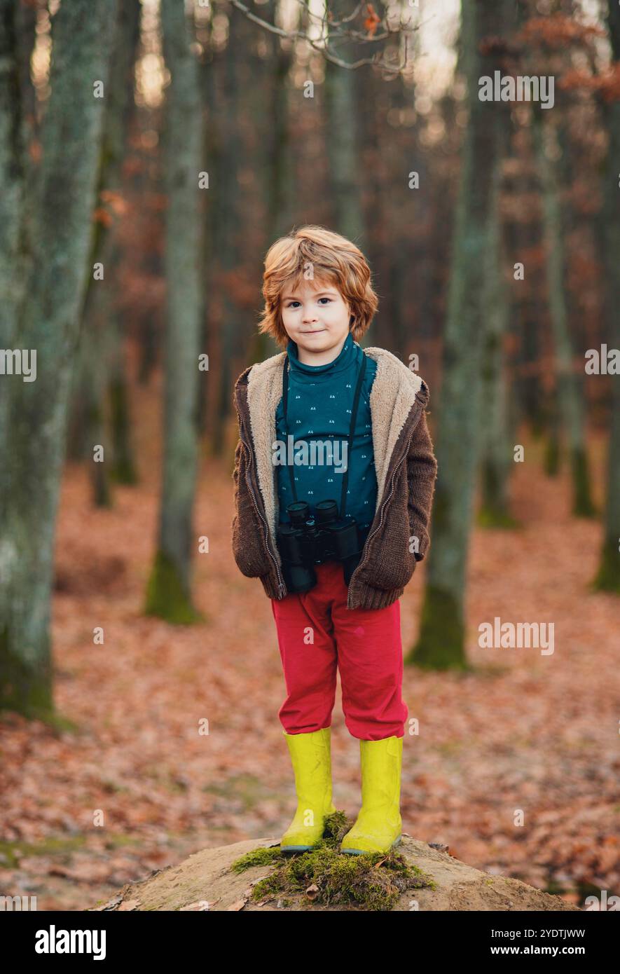 Autumn portrait of preschool boy in the park. Smiling kid over natural ...