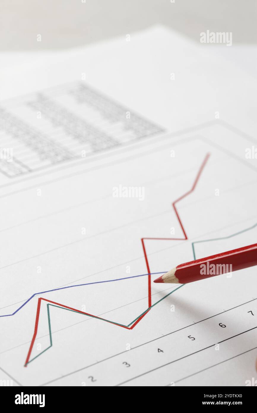 Graphs and red pencils Stock Photo - Alamy