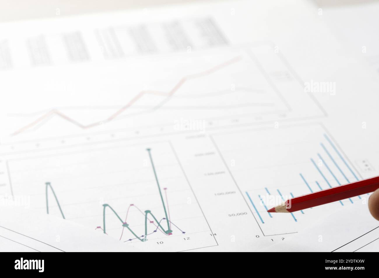 Graphs and red pencils Stock Photo - Alamy