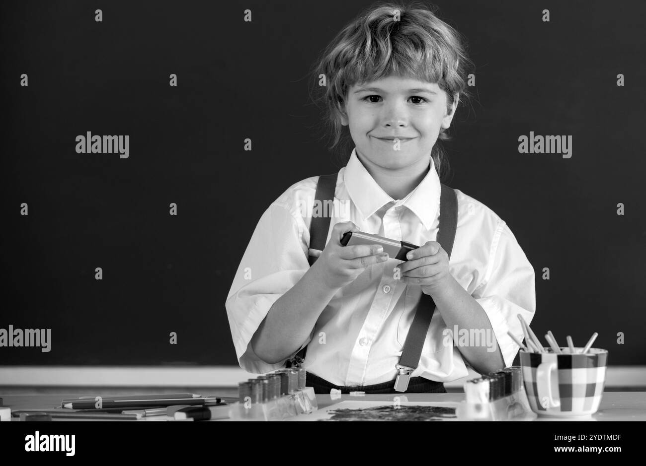 Child boy at school draws with paints. Kids artist creativity ...