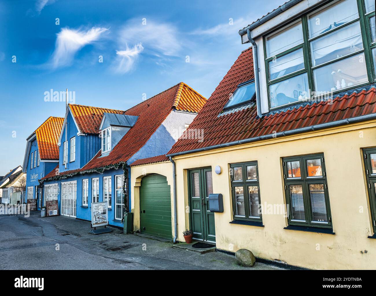 Picturesque coastal village scene Karrebaeksminde, with vibrant yellow ...