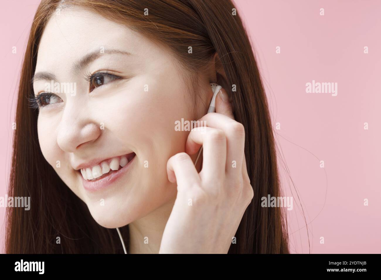 Woman earphone hi-res stock photography and images - Alamy