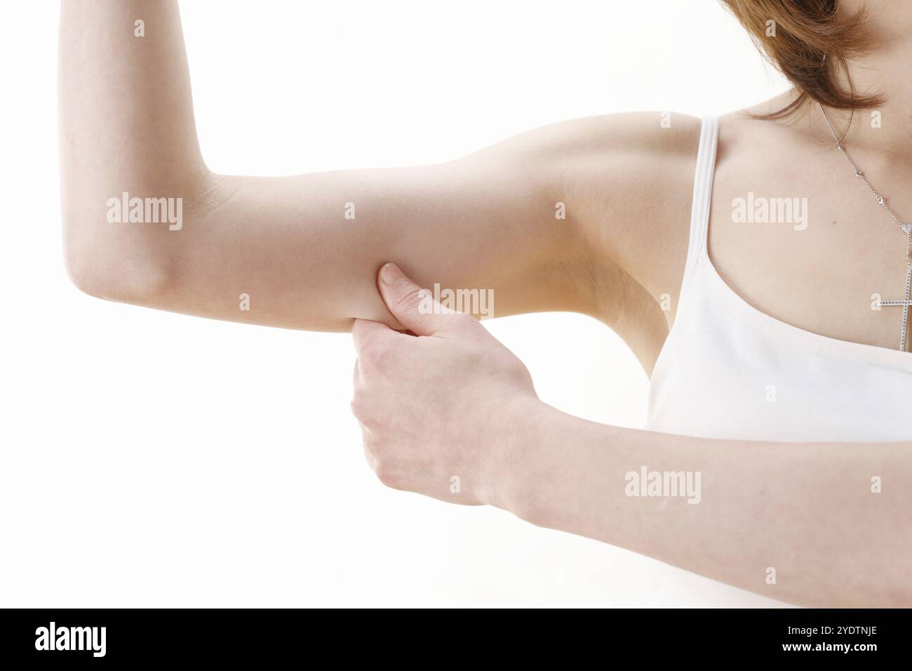 Pinching two arms Stock Photo - Alamy