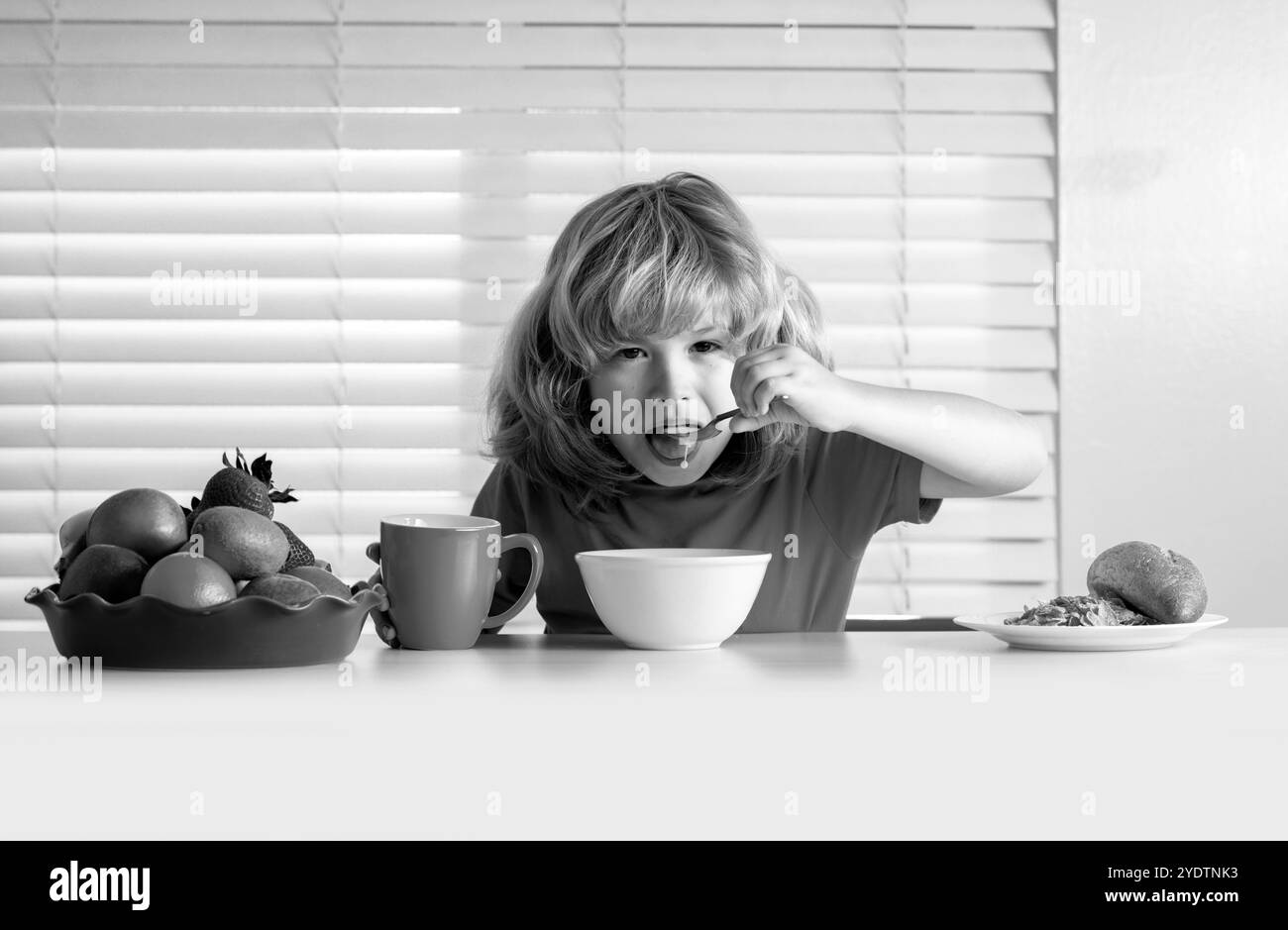 Little child boy having healthy breakfast. Kids nutrition and ...