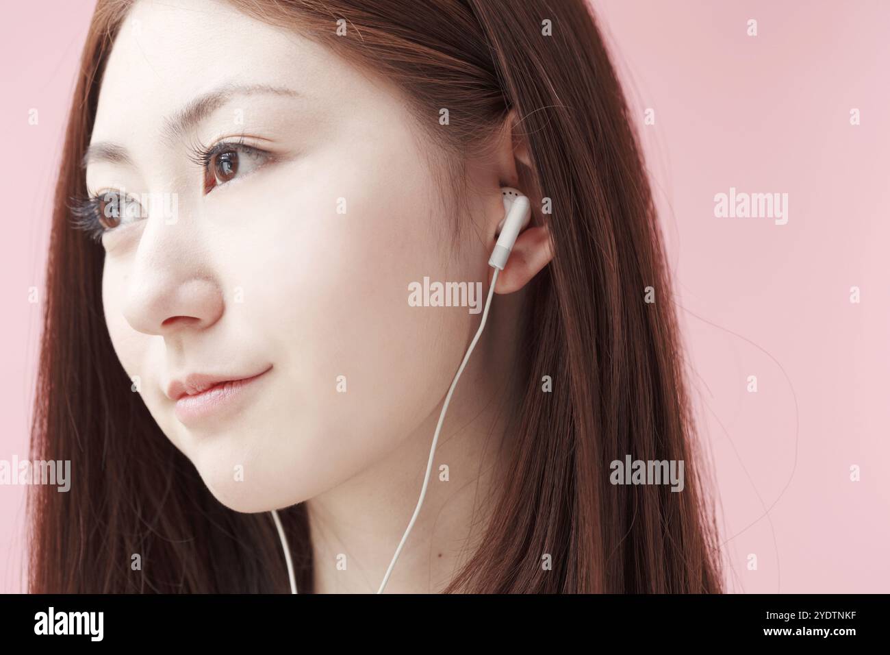 Woman earphone hi-res stock photography and images - Alamy