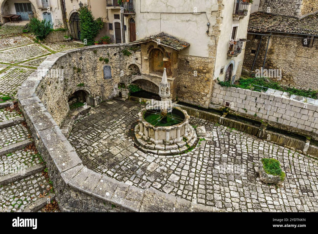 Aerial view of the square of Fontecchio with the medieval fountain and ...