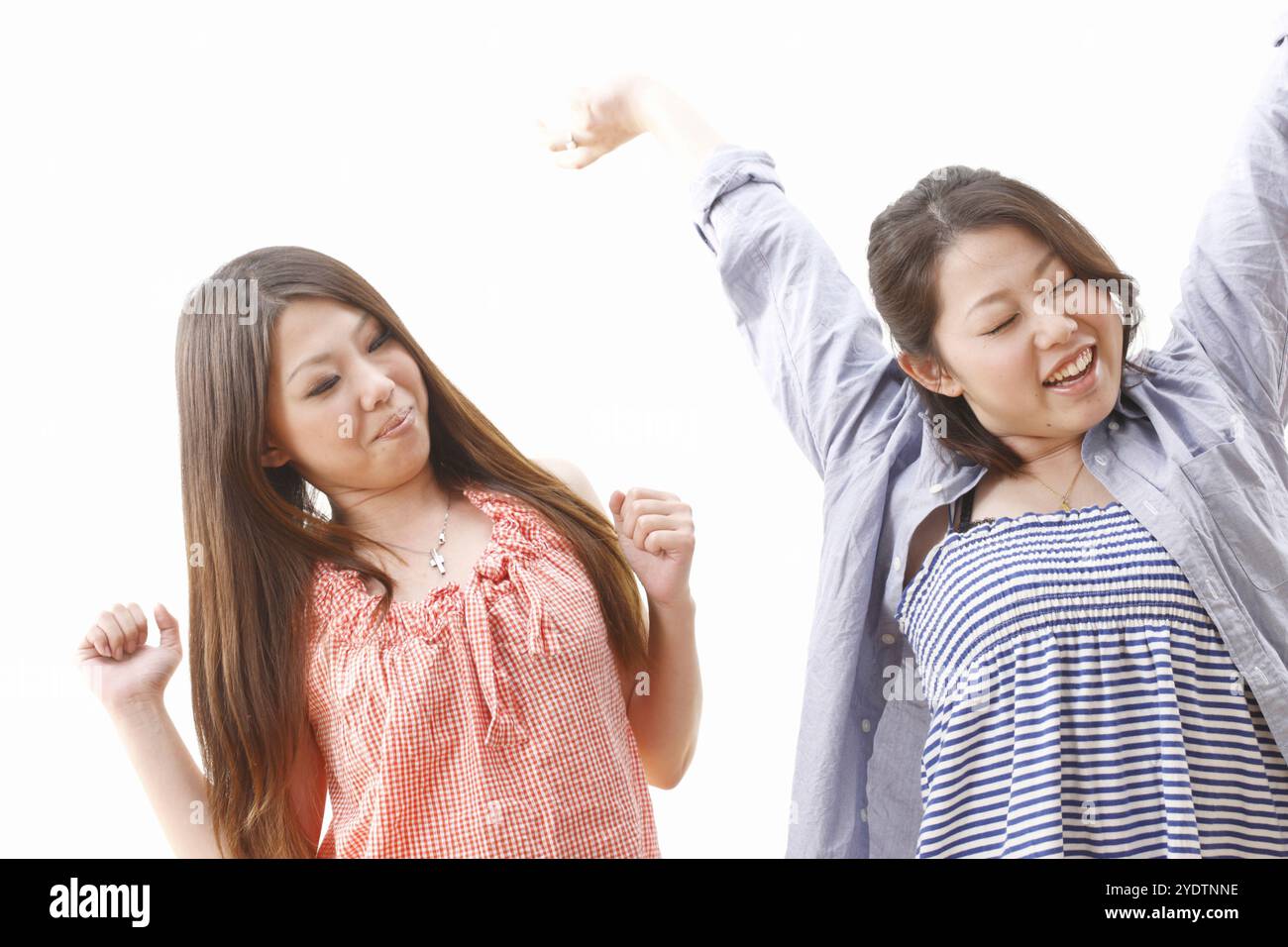 Two women standing tall Stock Photo - Alamy