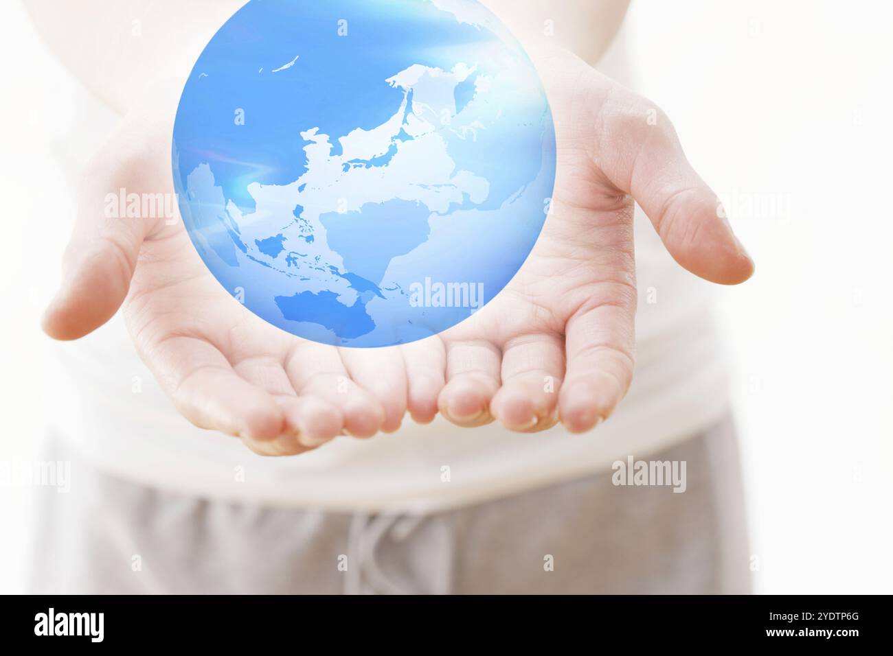 Hand and globe Stock Photo - Alamy