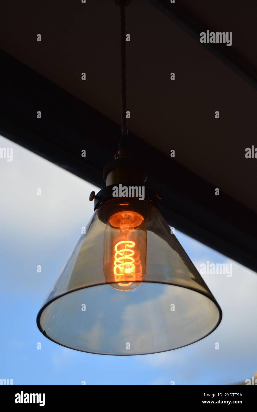 Hanging lightbulb contrast hi-res stock photography and images - Alamy