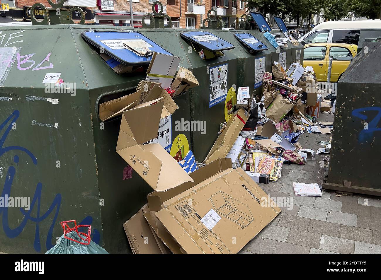 Overflowing paper containers in Hamburg, waste containers, recyclables ...