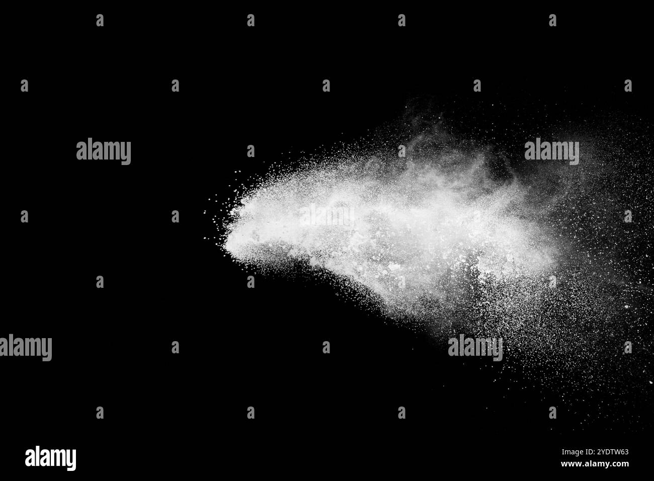 Bizarre forms of white powder explosion cloud against black background ...