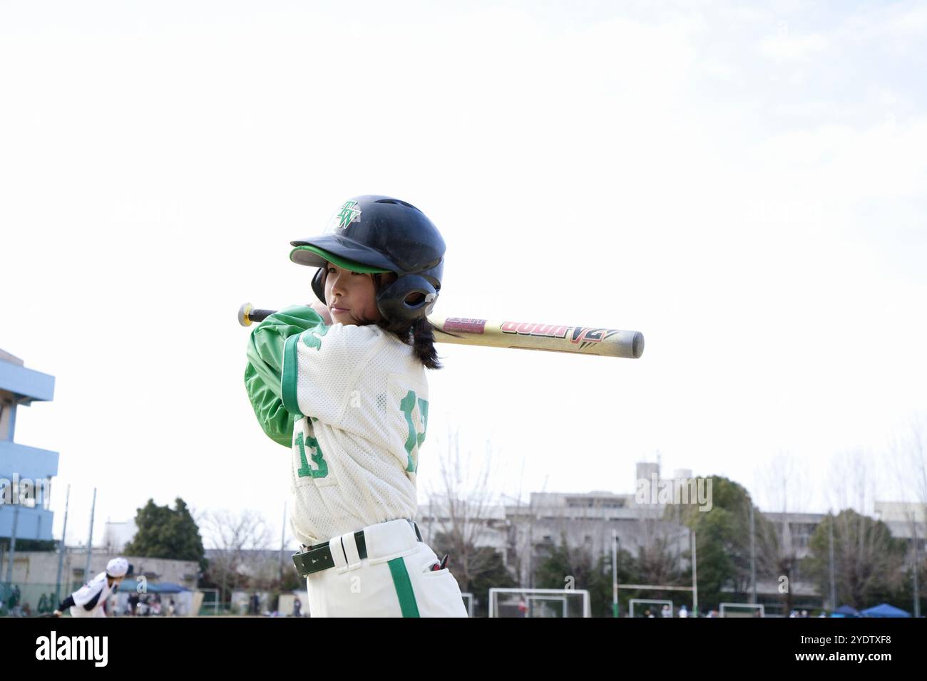 Baseball girl batting toss Stock Photo - Alamy