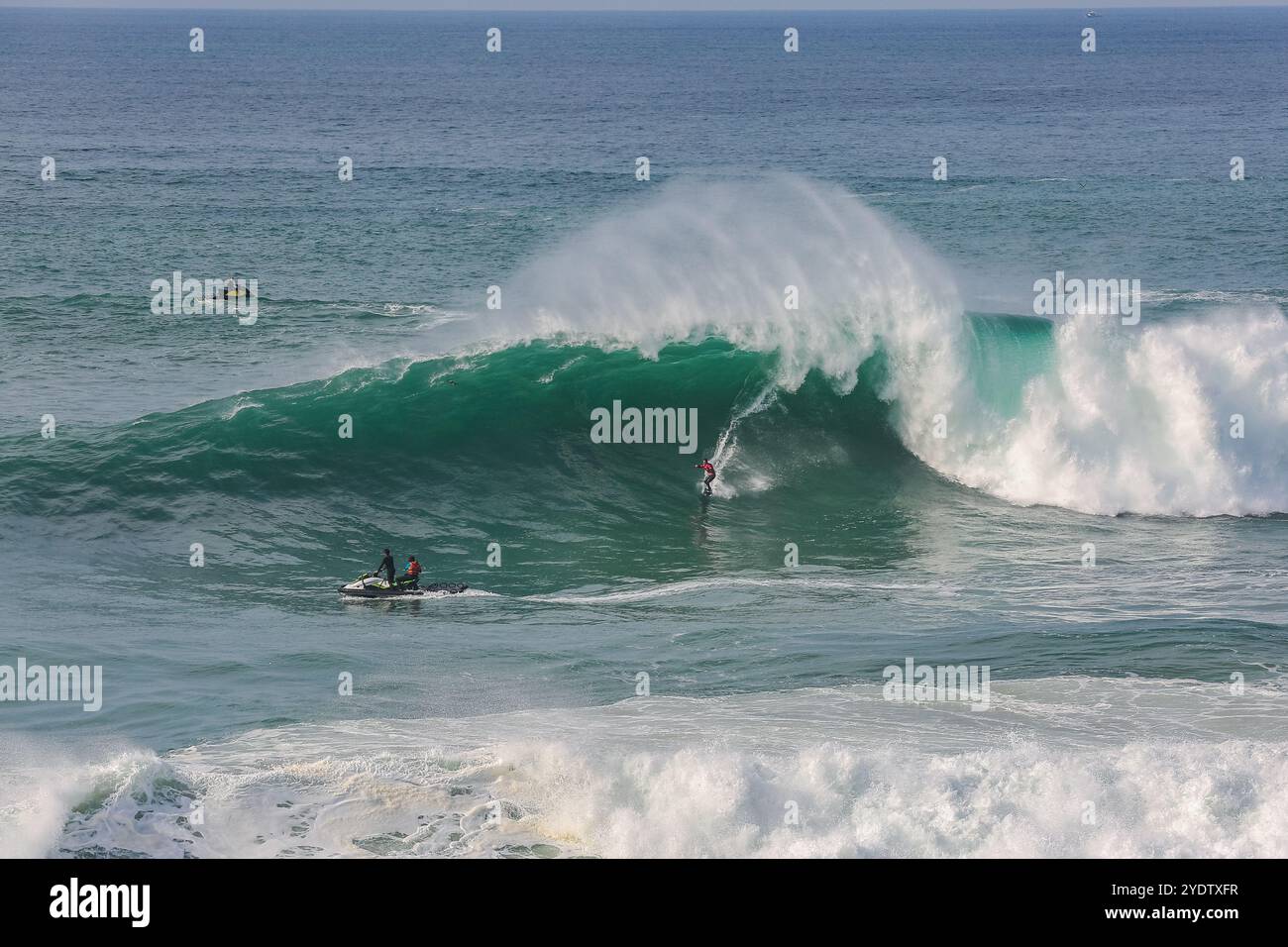 Big waves at Nazarè beach in Portugal, photographs of surfers having ...
