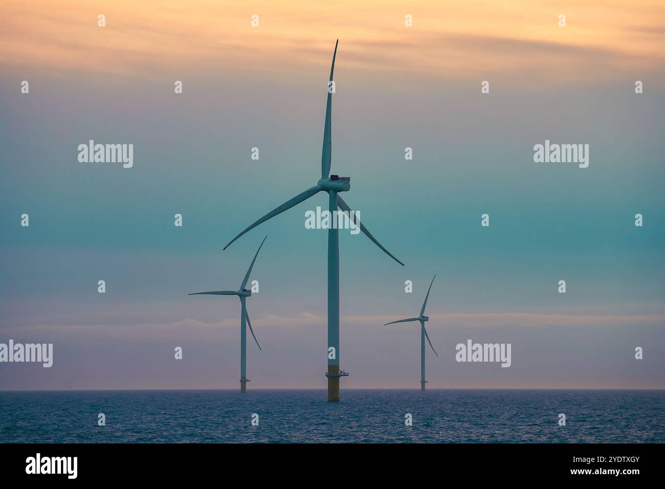 Offshore wind turbines standing in the sea. Wind turbine generator ...