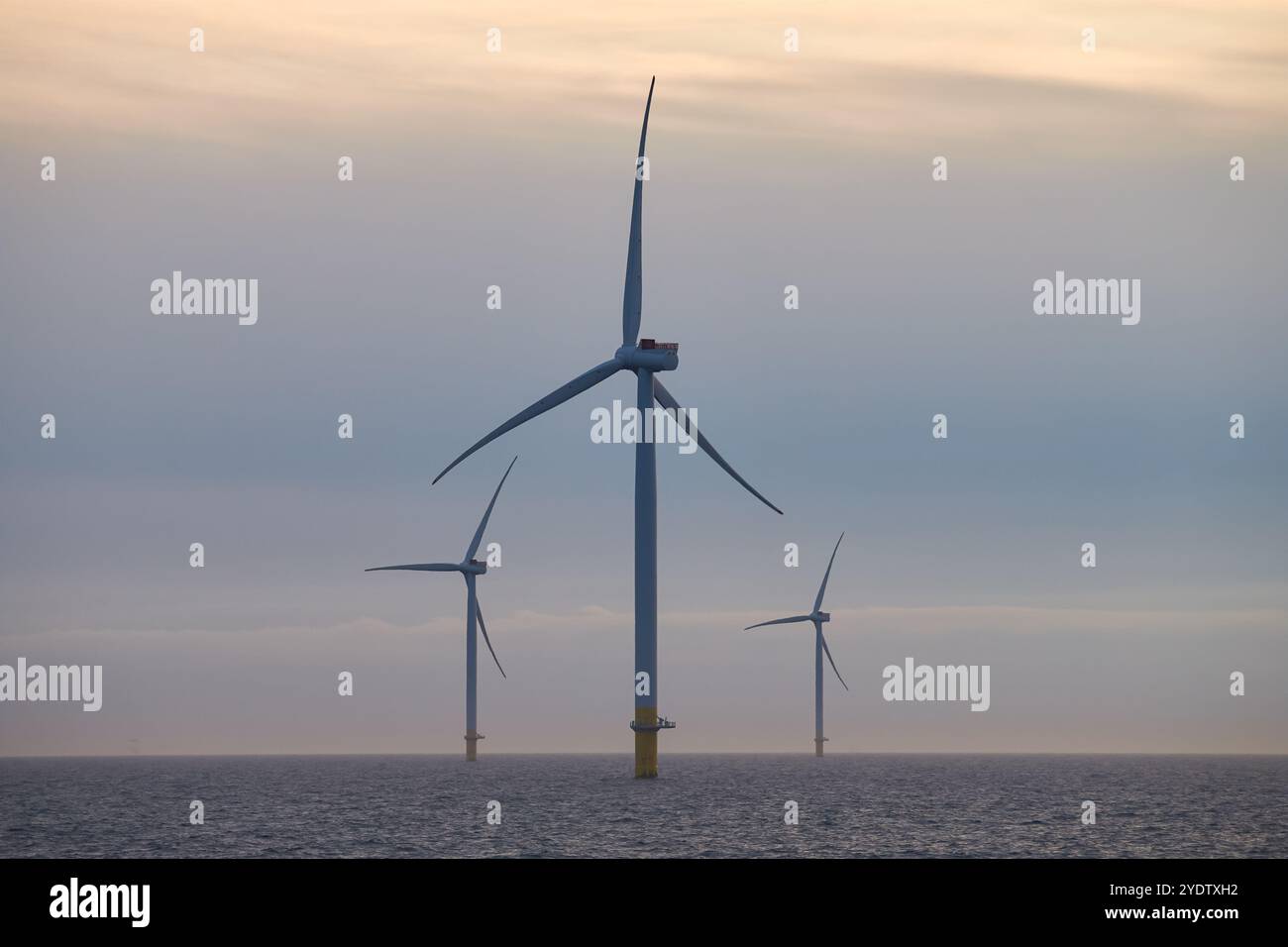 Offshore wind turbines standing in the sea. Wind turbine generator ...