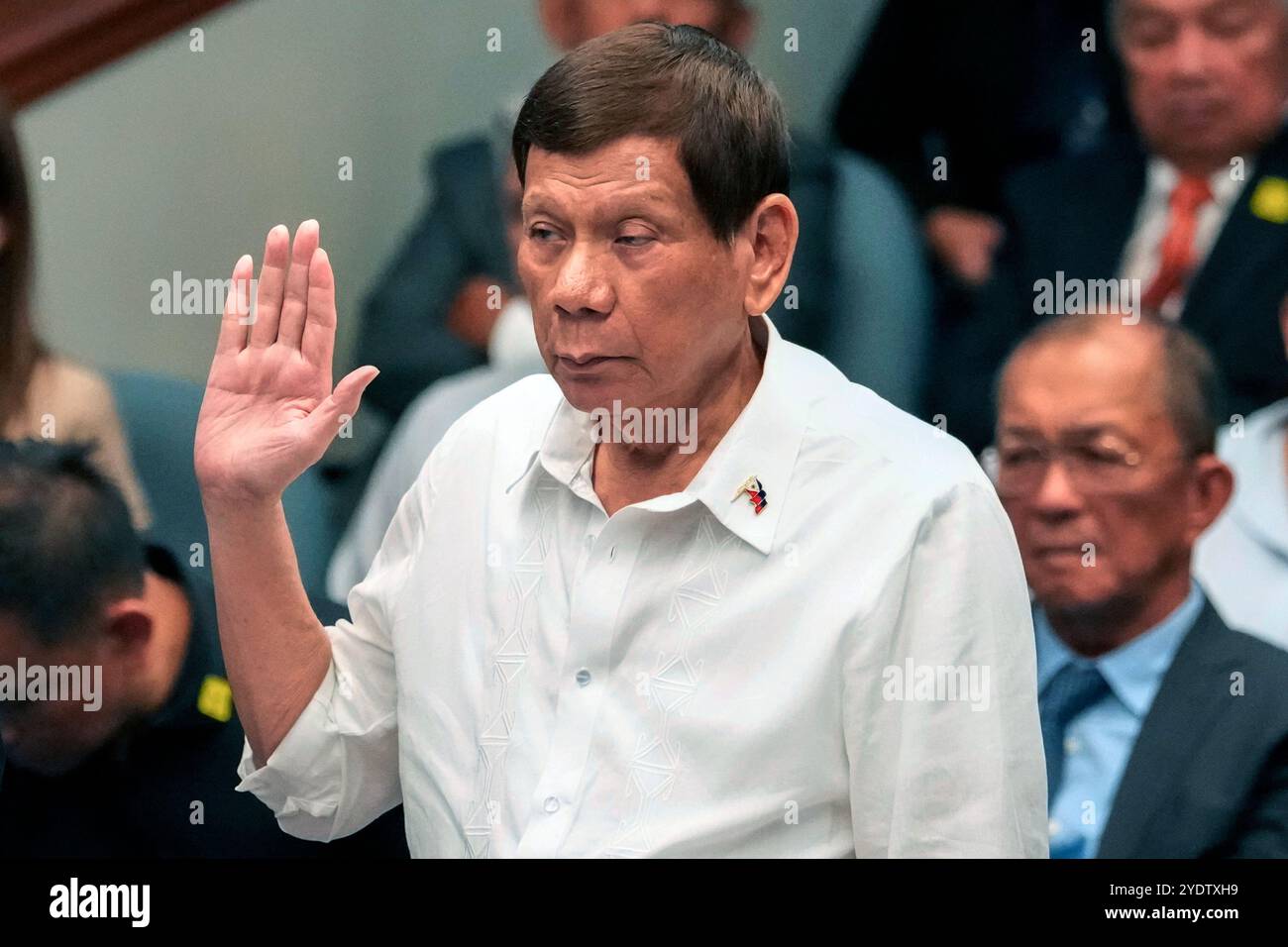 Former Philippine President Rodrigo Duterte takes oath during a senate ...