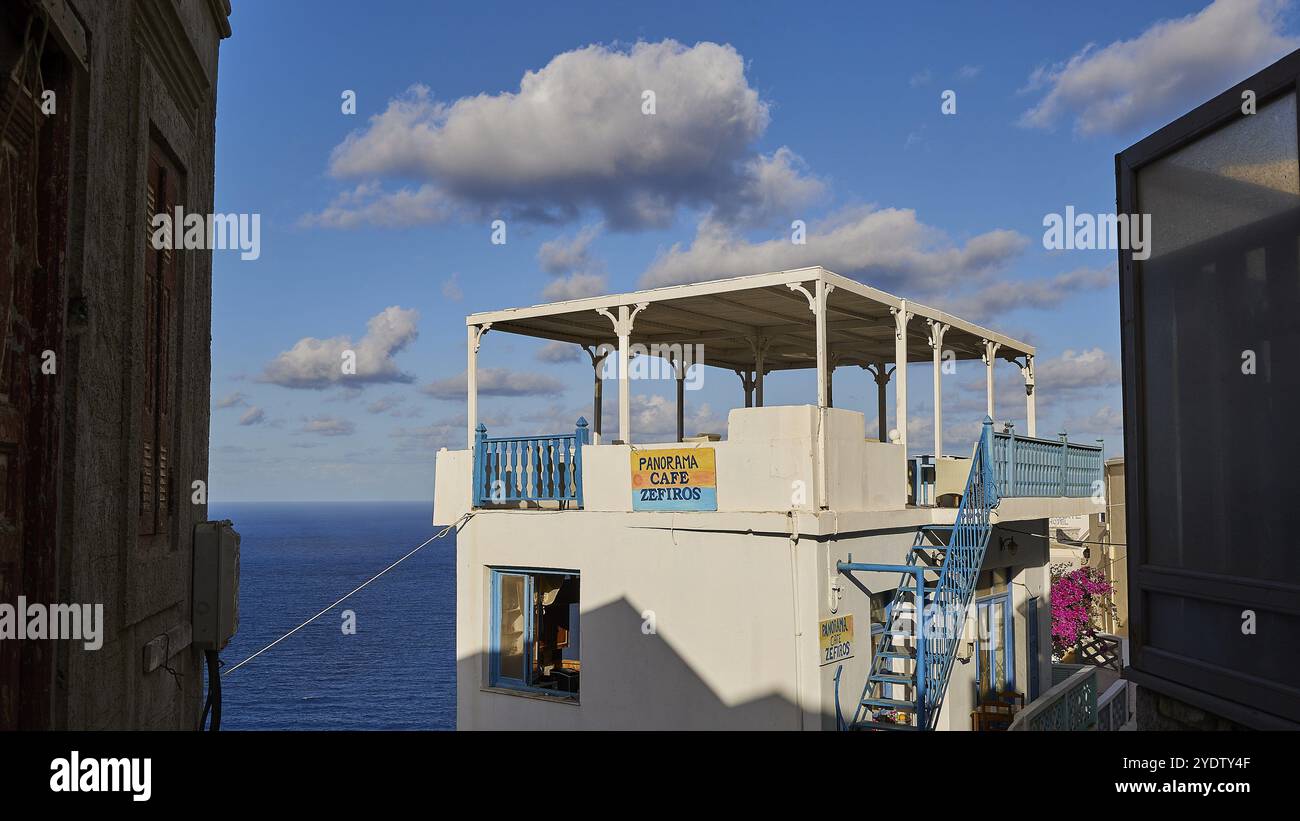 Veranda with panoramic sea view under a blue sky, with decorative ...