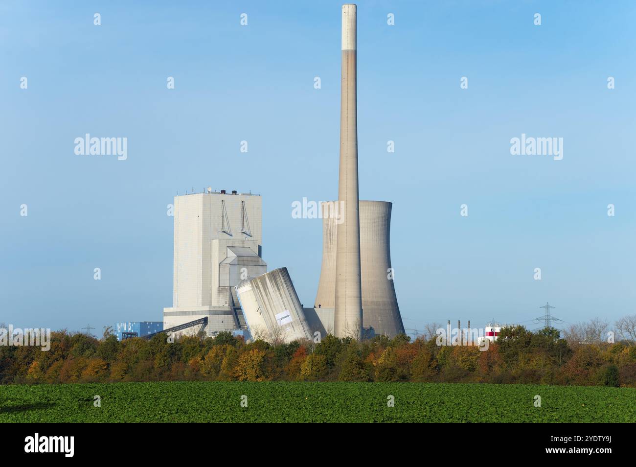 Industrial plant in the implosion phase, surrounded by autumn landscape ...