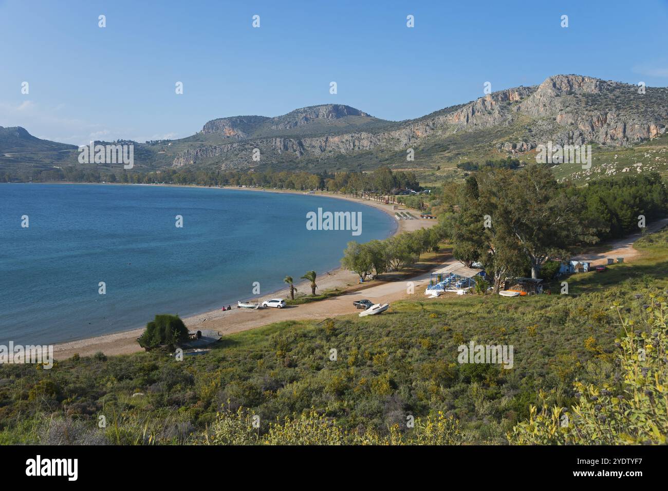 Sandy beach beach on a wide bay surrounded by mountains and clear blue ...