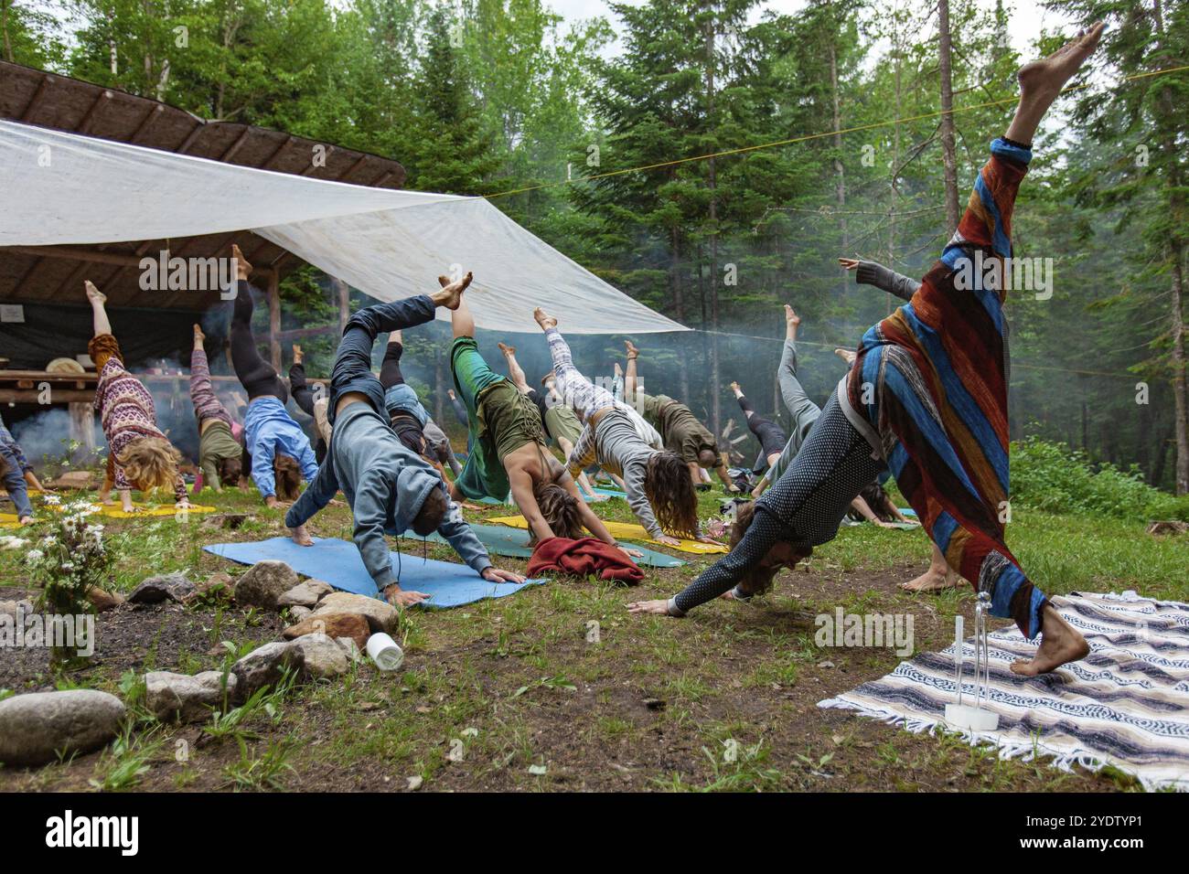 A colorful mix of intergenerational people are seen practicing ...