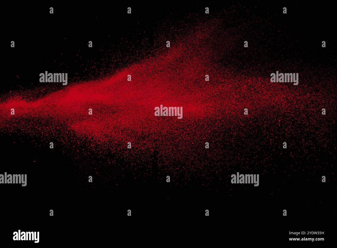 Red color powder explosion on black background.Freeze motion of red ...