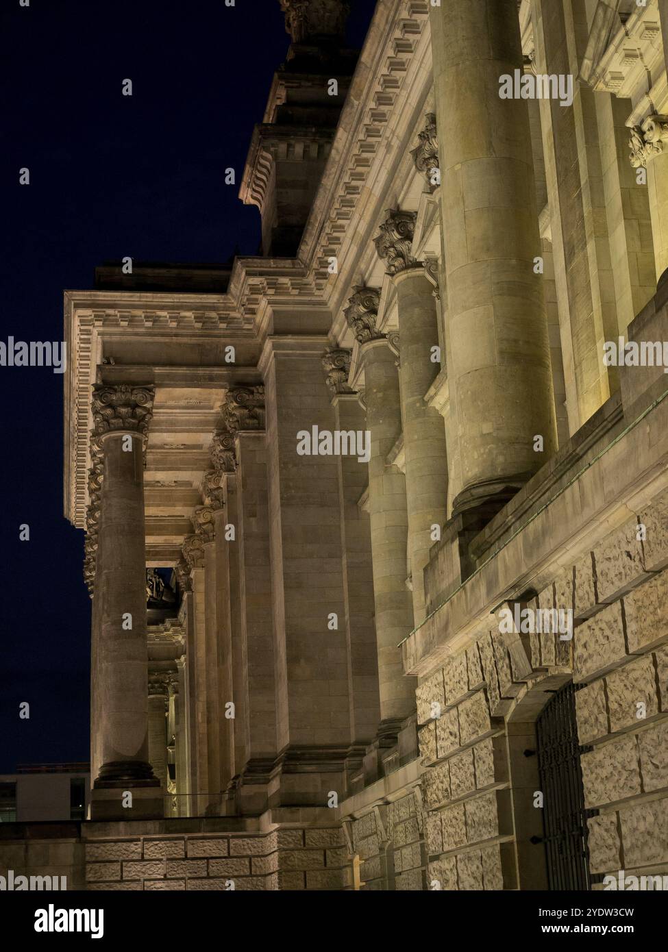 Illuminated columns of a classical building at night, Berlin, Germany ...