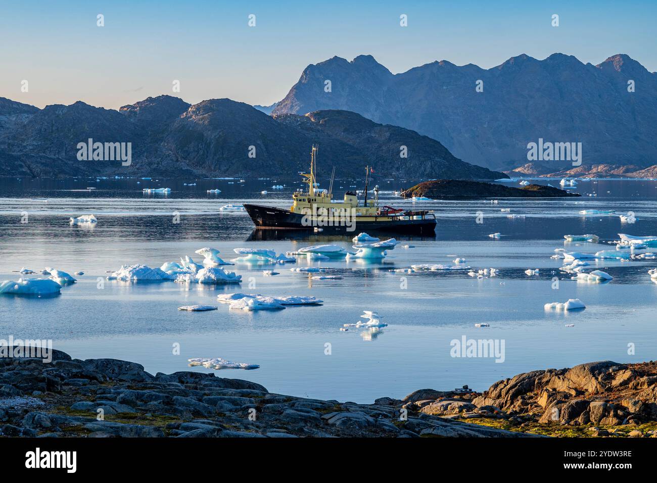 Fishing trawler in the mountainous fjord, Kulusuk, Greenland, Denmark ...