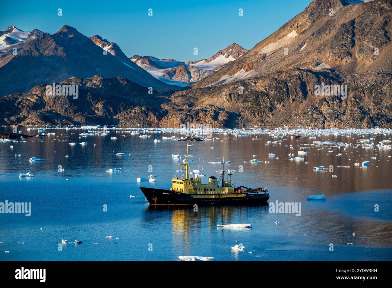 Fishing trawler in the mountainous fjord, Kulusuk, Greenland, Denmark ...